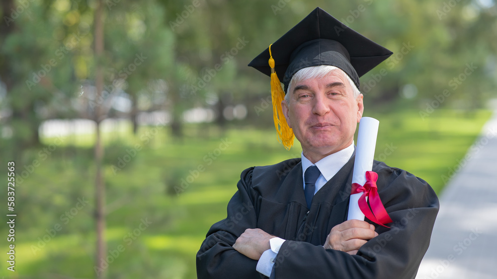 Foto de Portrait of an elderly man in a graduation gown and with a ...