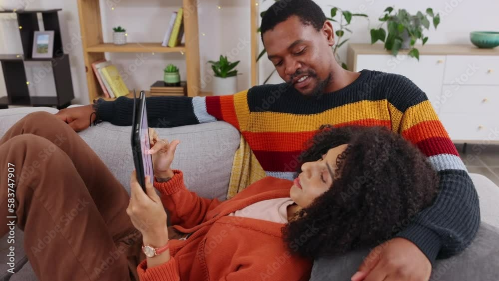 Black couple, tablet and relax on couch in home living room with comic ...