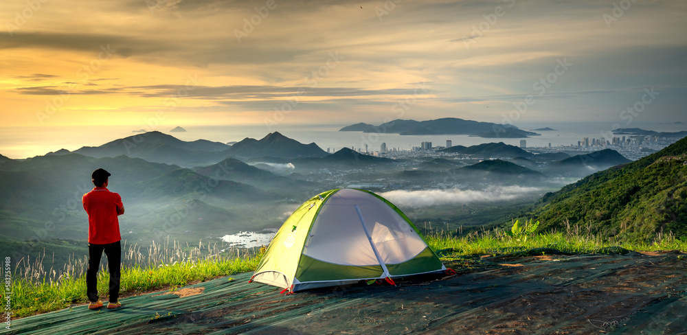 camping tent on the high mountain, looking into the distance is the ...