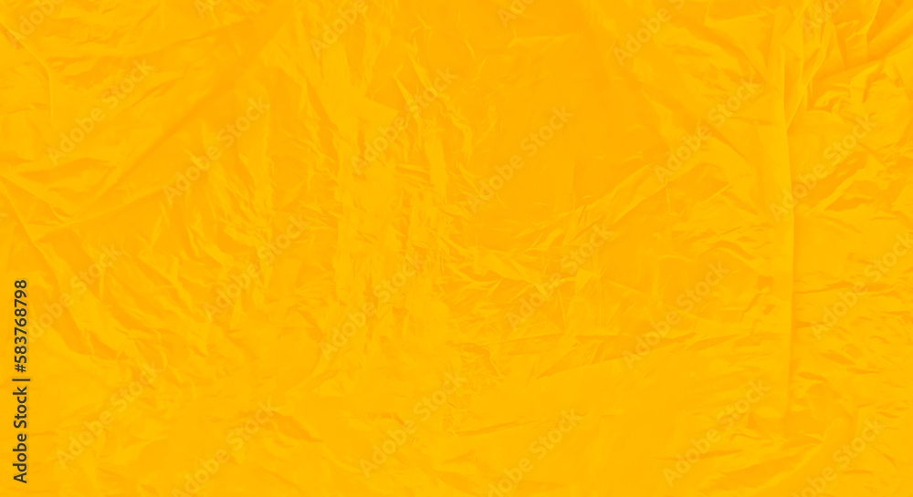 Crumpled yellow polythene and plastic background with copy space text ...