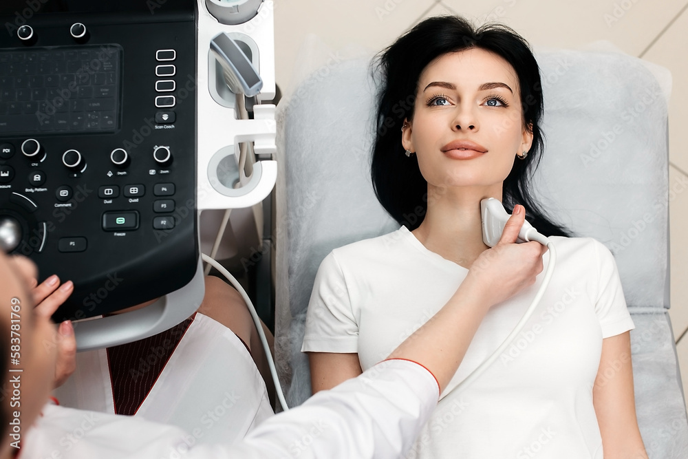 Ultrasound diagnosis of the thyroid gland of a young woman in the ...
