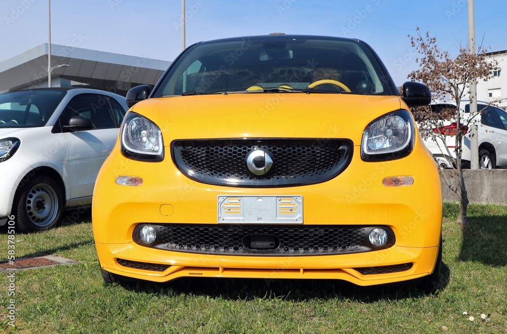 Udine, Italy. March 18, 2023. Front view of the new yellow Smart Fortwo ...
