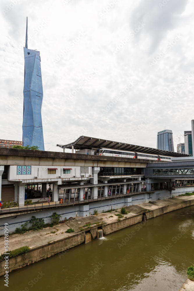 Metro LRT train of Kelana Jaya Line at Pasar Seni station and ...