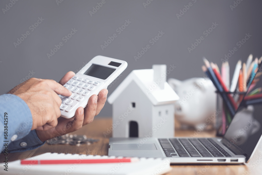 House purchase and cost idea, Home interest calculate concept. Man ...