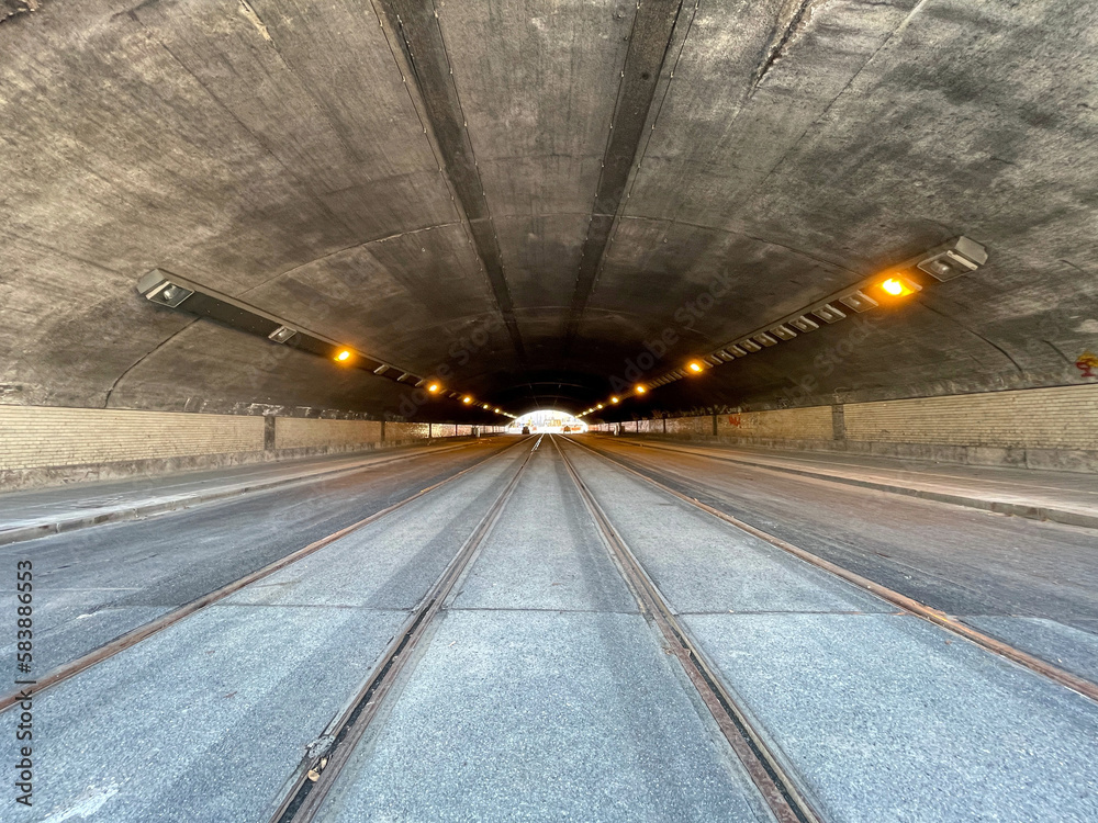 Old tunnel with road and rails for tram without traffic Stock Photo ...