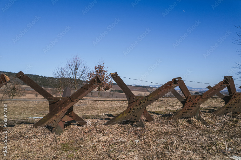 Iron anti-tank, czech hedgehog, obstacles in the meadows with the ...