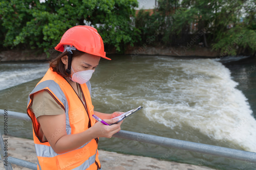 Asian Female engineering working . at sewage treatment plant,Marine ...