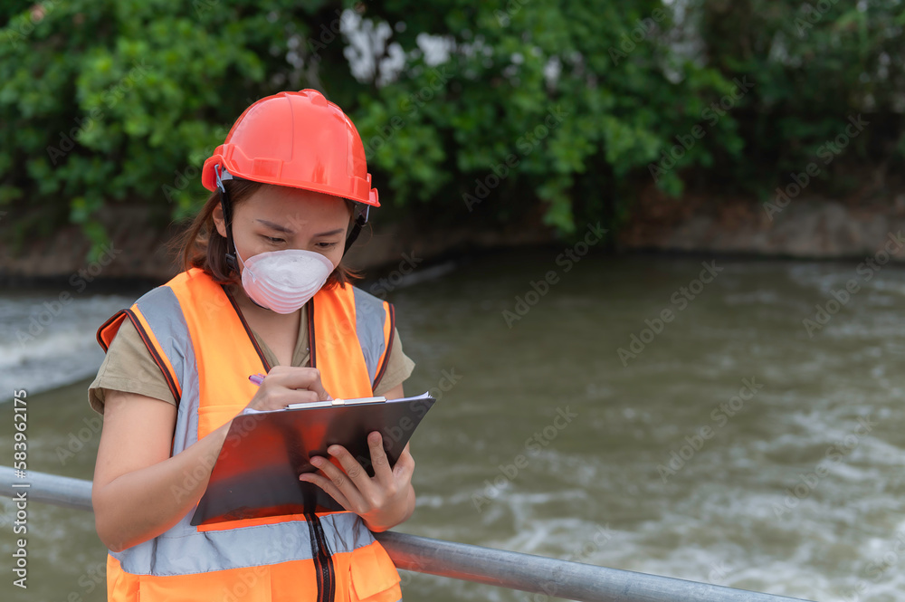 Asian Female engineering working . at sewage treatment plant,Marine ...