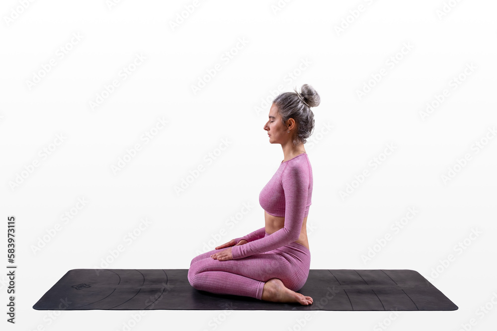 woman practicing yoga - sitting hero pose variation - virasana Stock ...