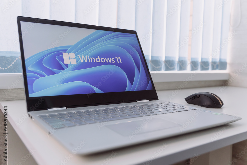 Windows 11 logo on laptop screen. A new operating system update from ...