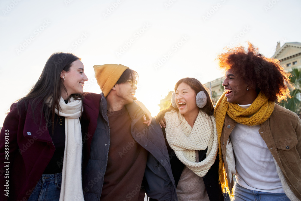 Multi-ethnic group of happy friends hugging and having fun. Smiling young people laughing ...