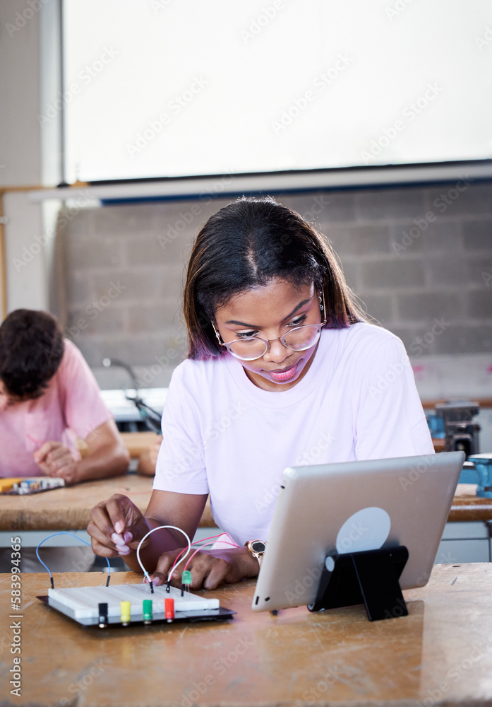 Vertical young Latin girl student at technical high school are in ...