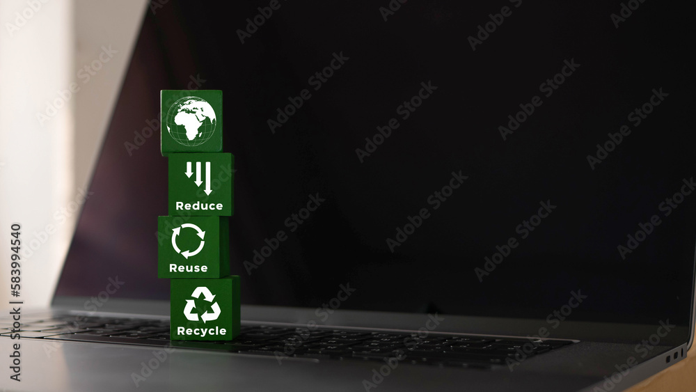 Foto de The green wooden blocks placed on the Laptop with symbols and ...