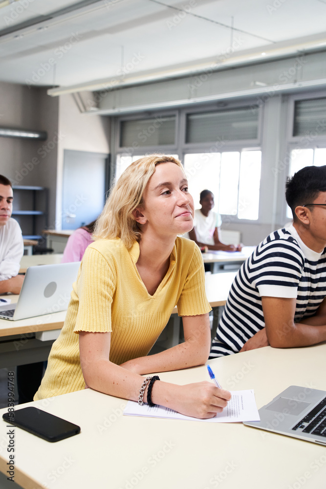 Vertical photo of High school science class: A boy and girl using a ...