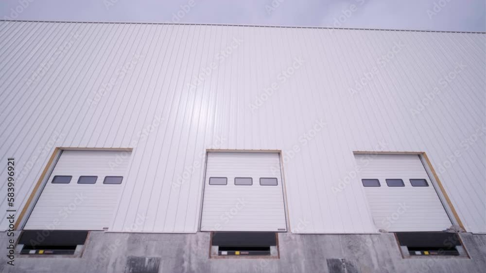 Construction process of a big, modern warehouse with multiple garage ...