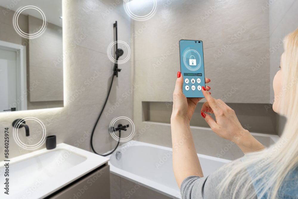 Female hands holding phone with app smart home screen in room house ...