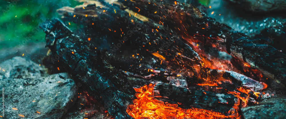 Vivid smoldered firewoods burned in fire closeup. Atmospheric ...