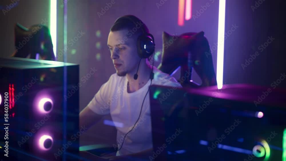 Computer Gamer Having Fun And Smiling While Gaming At Cyber Sport ...
