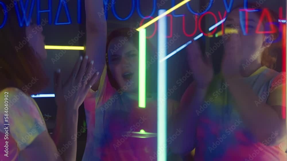 Team of young girls are celebrating victory in video game tournament ...