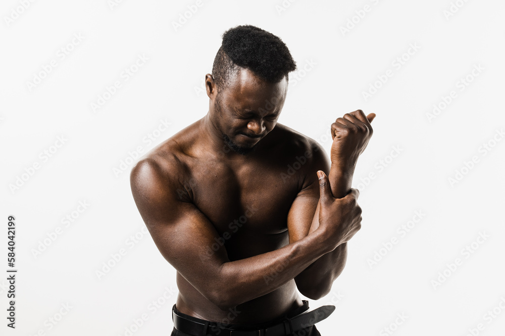 Sport traumatology. Wrist injury of muscular african american man on ...