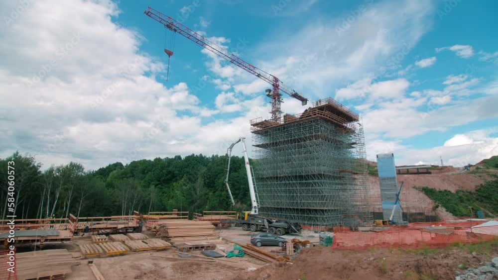 Building site with construction tower crane and materials for road ...