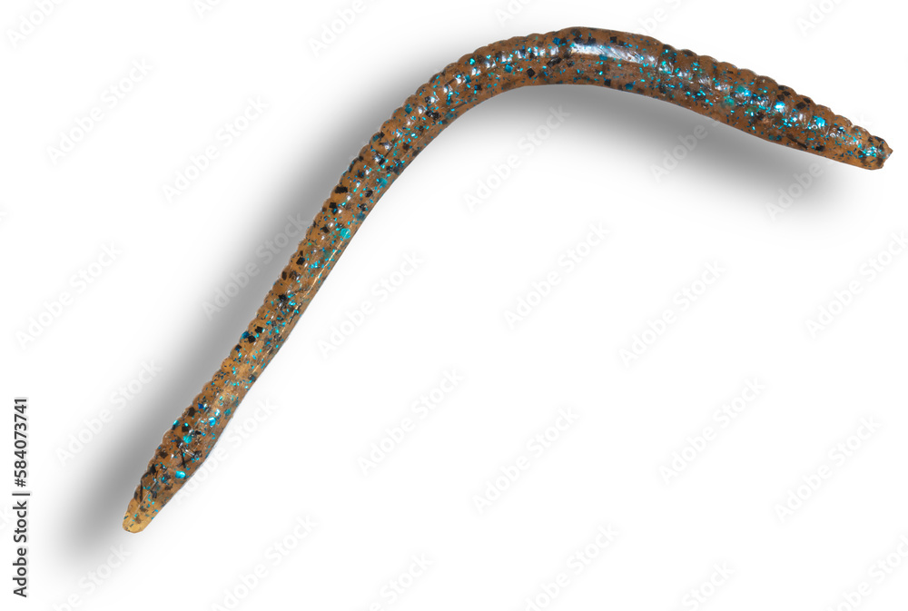 shadow behind a rubber fishing worm with tan color and colorful specks ...