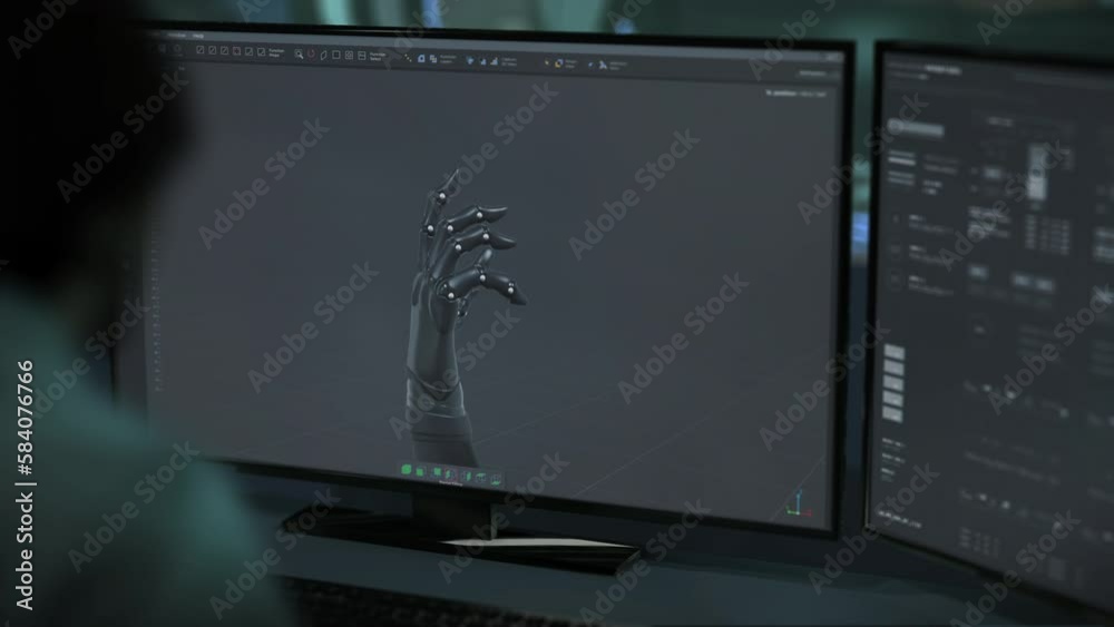 Specialist creating a prototype of a futuristic hand model in computer ...