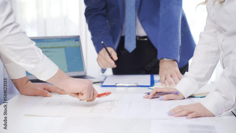 After completing work on the project, the team shake hands with each ...