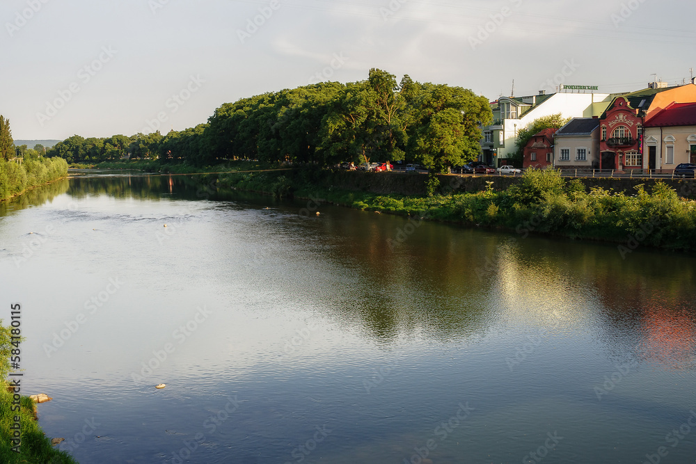 old town with river. waterfront with old architecture in the distance ...