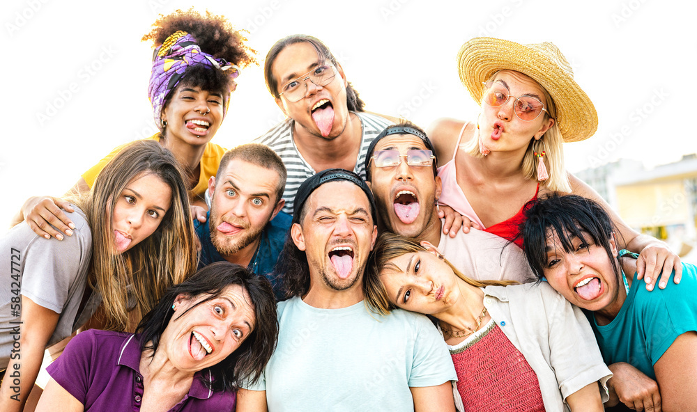 Foto de Multicultural mixed age people taking selfie sticking out ...