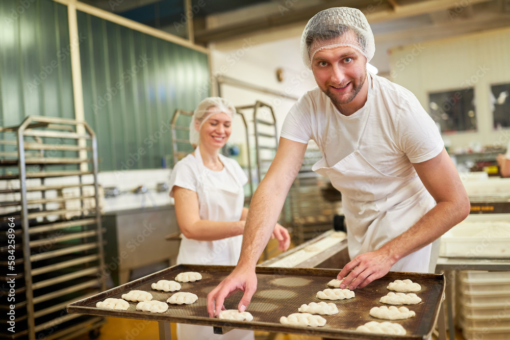 Baker apprentice in training makes yeast braids Stock Photo | Adobe Stock
