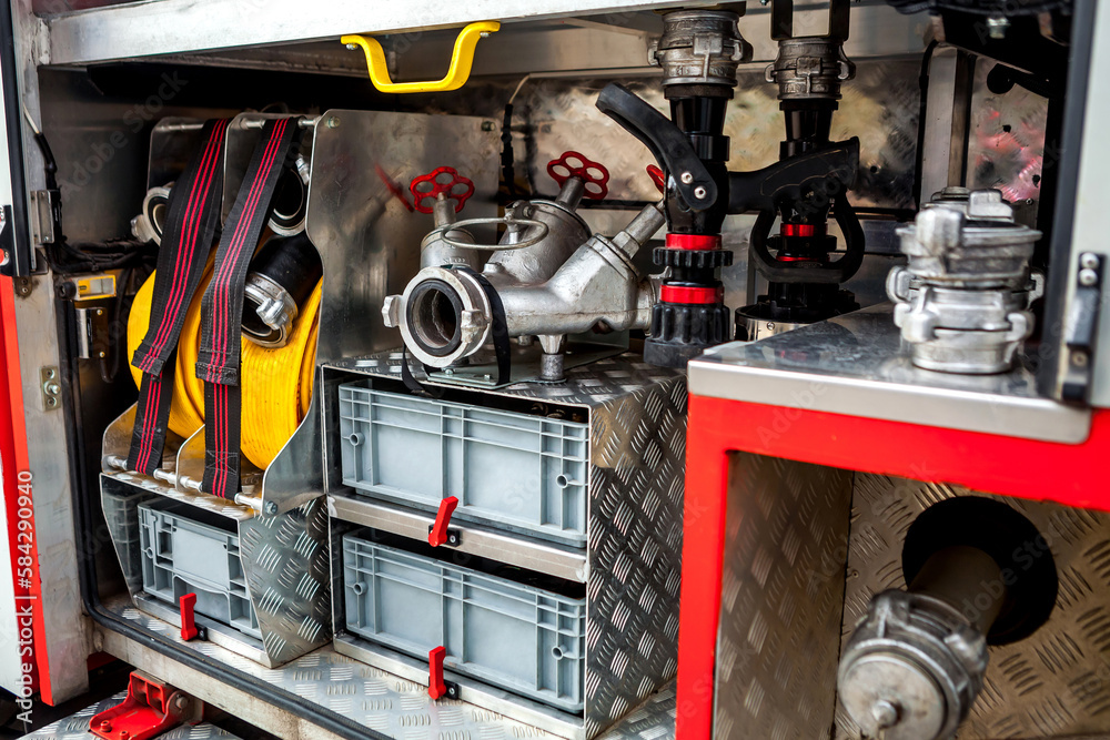 Foto de Compartment of rolled up fire hoses on a fire engine. Rescue ...