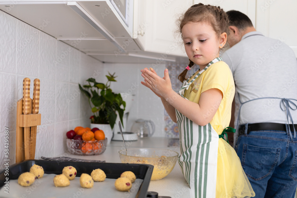 child help to father in kitchen. kid cooking food with dad. little girl ...