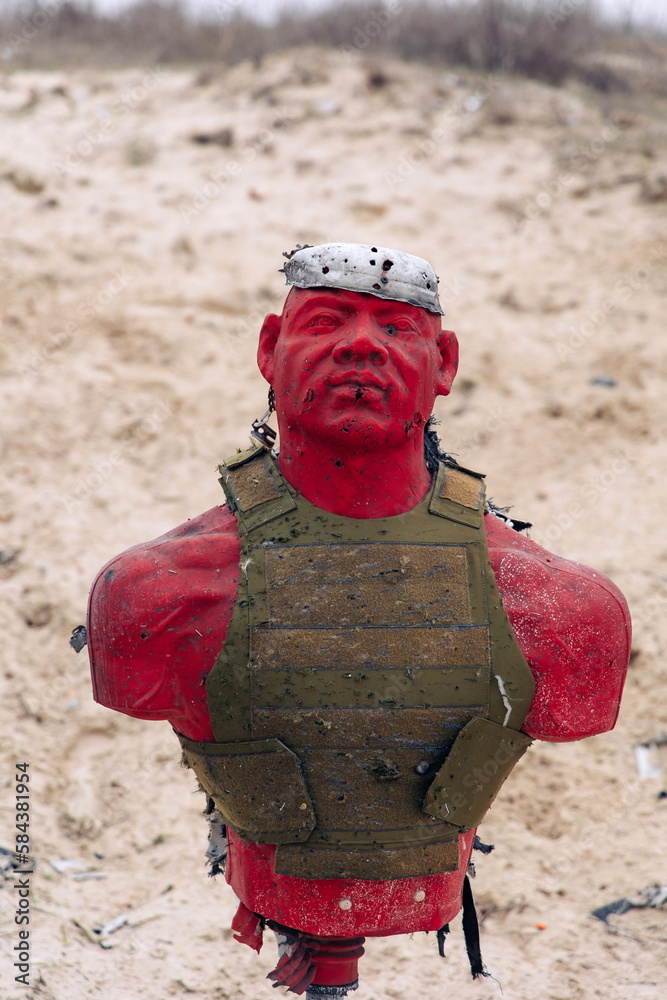 Dummy in body armor shot through with firearm at training shooting ...