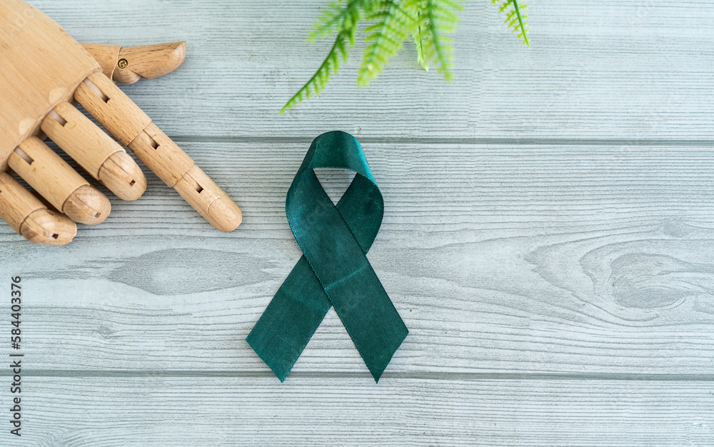 National Aplastic Anemia And Mds Awareness Week Green Awareness Ribbon With Wooden Hand Stock