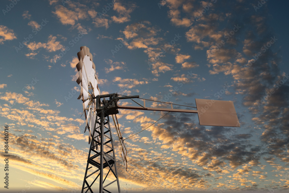 Traditional wind turbine with dramatic cloudy sky view. Old wind ...
