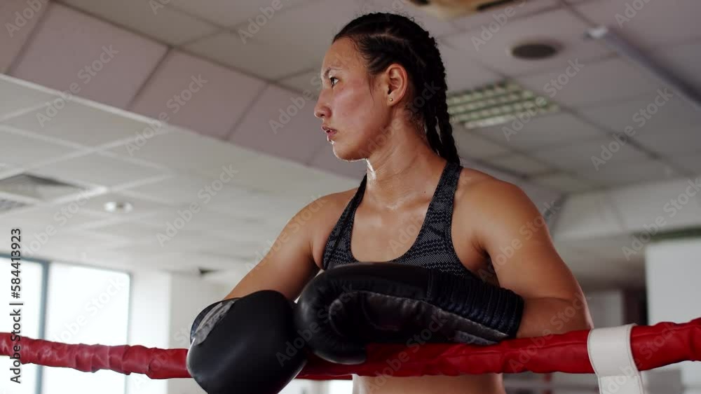 Video Stock Young asian female boxer with a confident face stands by ...