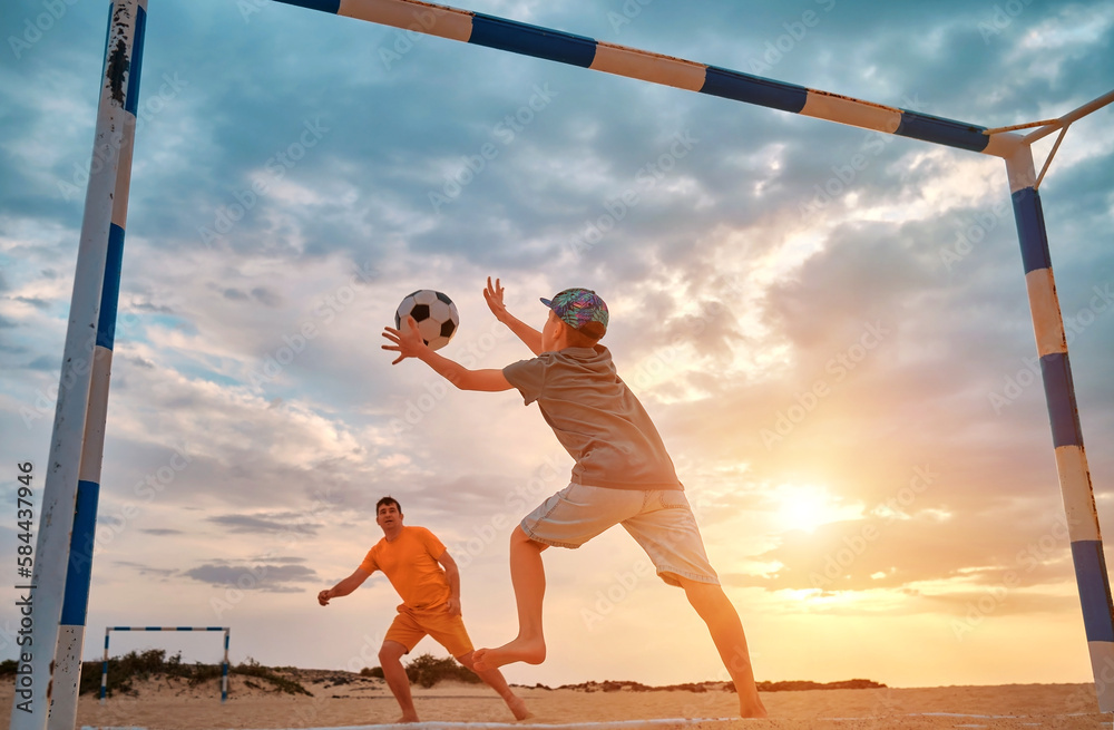 Father and Son playing football, family fun outdoors players in soccer ...