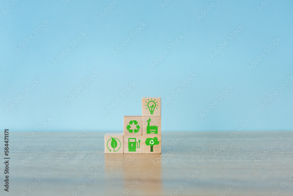Wooden cubes with abbreviation ESG icons on blue background. ESG ...