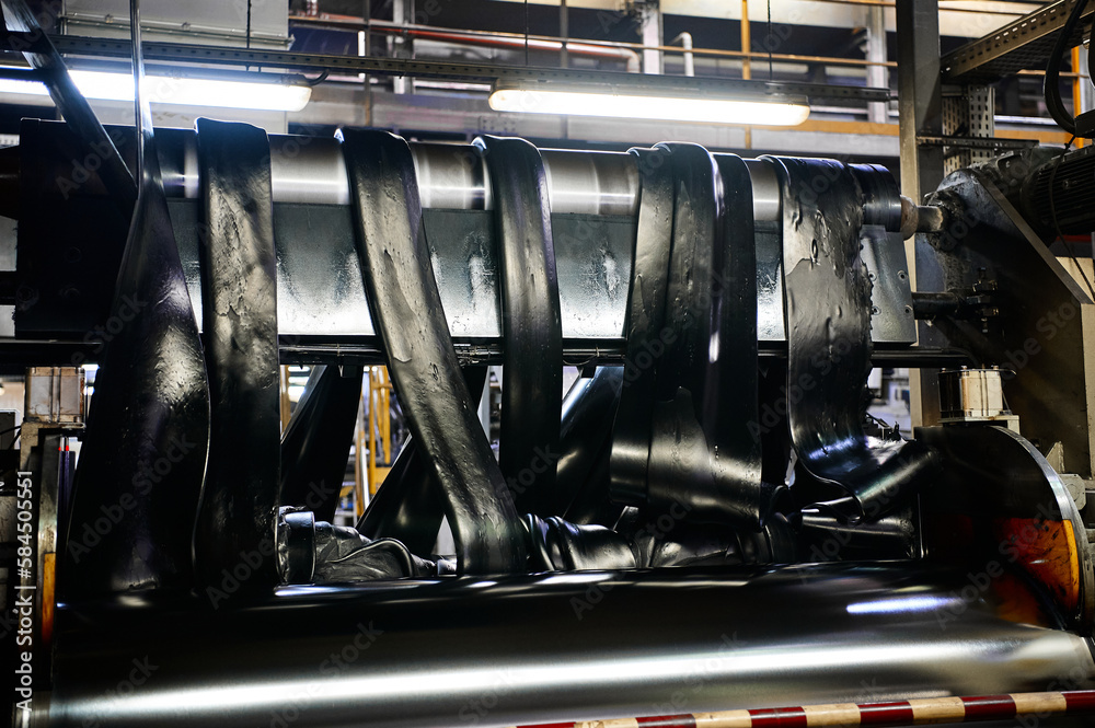 Rubber strips on metal rollers at compound calendering Stock Photo ...