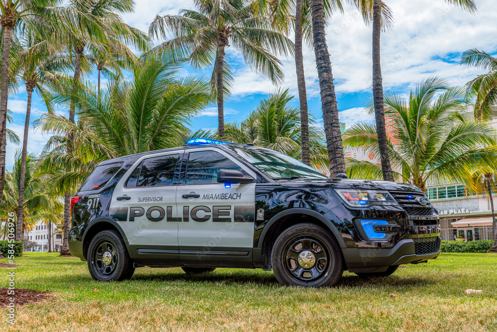 MIAMI, FLORIDA - CIRCA JULY, 2022: Police car side view on a grass at ...