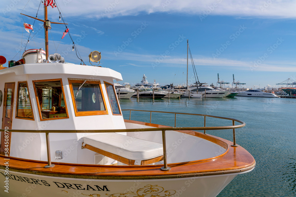 MIAMI, FLORIDA - CIRCA JULY, 2022: White boat with wood frames at Miami ...