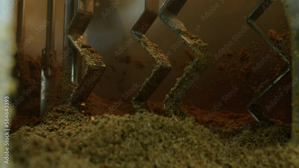 Close-up shot of mass of spent grain lying inside lauter tun with ...