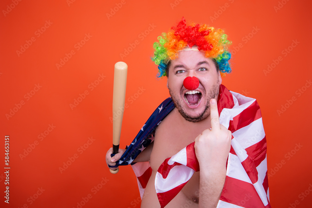 Funny fat man in a clown costume. Joy and anger. Stock Photo | Adobe Stock