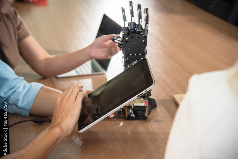 Asian Student Assembling Robot is Moving. Computer Motherboard ...