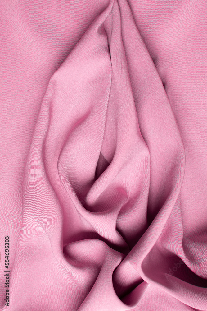 Pink soft fabric shaped as female genital organs, vulva and labia ...