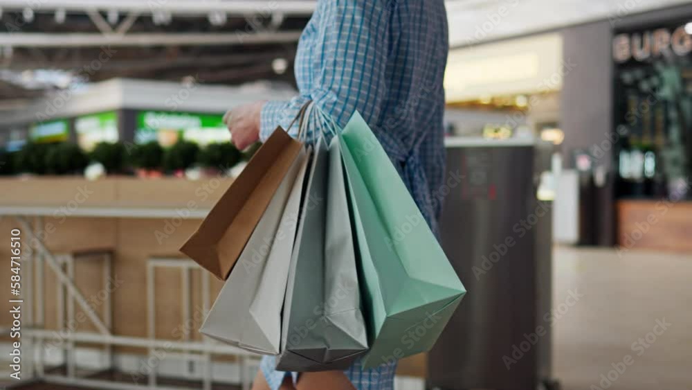 Shopper, Shopper chooses clothes Slowly Walks through the super store ...