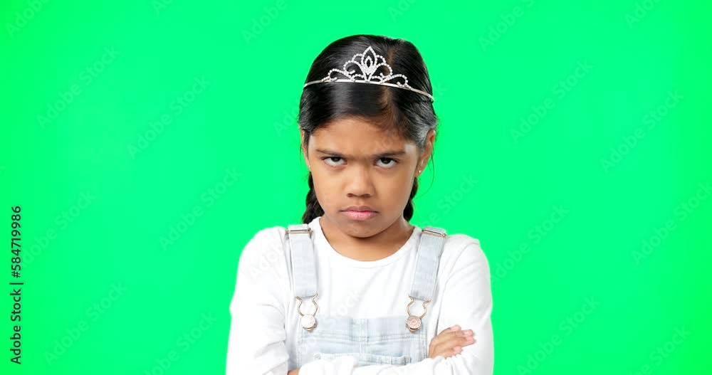 Anger, upset and child with crossed arms on green screen with crown ...
