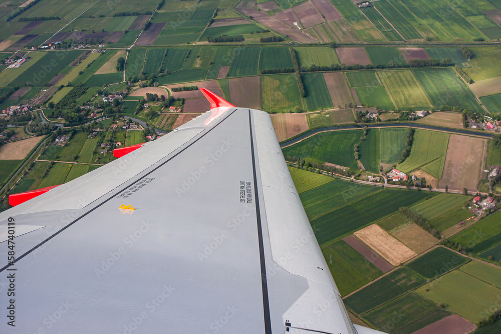 Wing view during flight Stock Photo | Adobe Stock