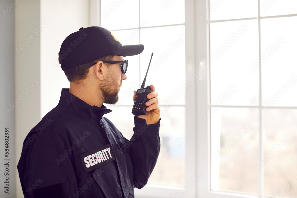 Poster Security guard man in black uniform hat and jacket with SECURITY ...